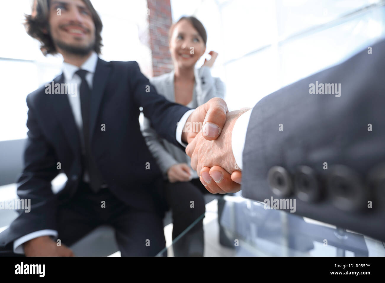 Closeup of a business hand shake Stock Photo - Alamy