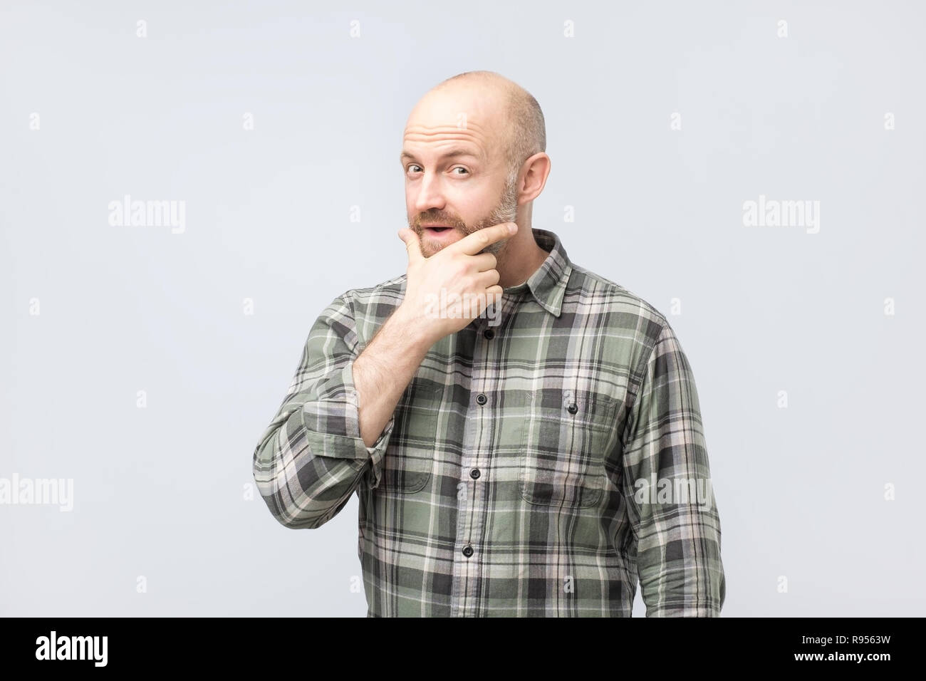 Middle aged man thinking, expressing leadership reflections and ...