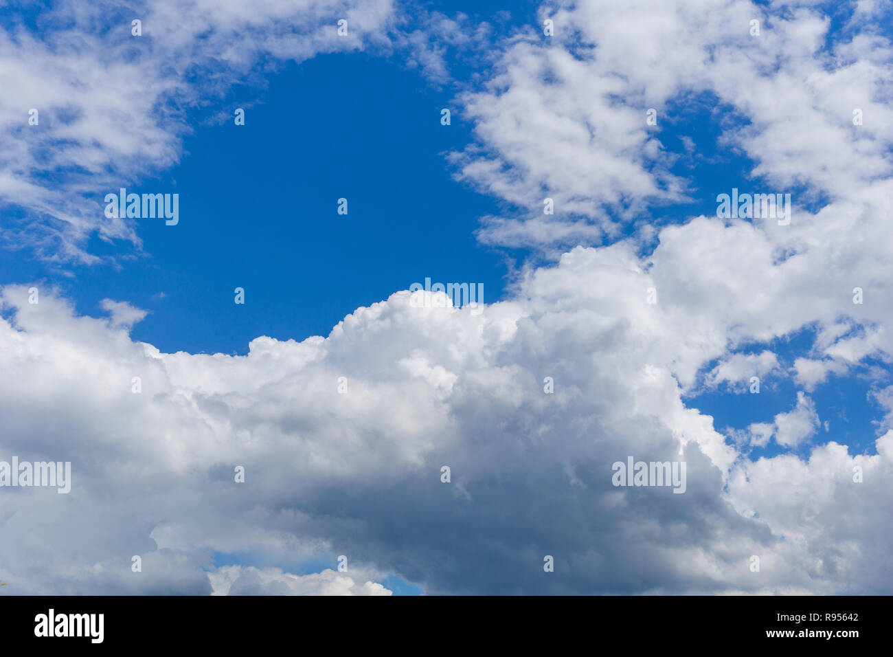 View of white fluffly Clouds on a beautiful Blue Sky Stock Photo - Alamy