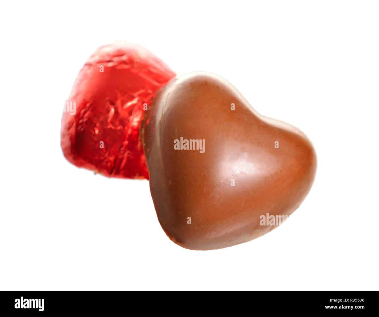 Red Foil wrapped chocolate hearts isolated on white background Stock ...