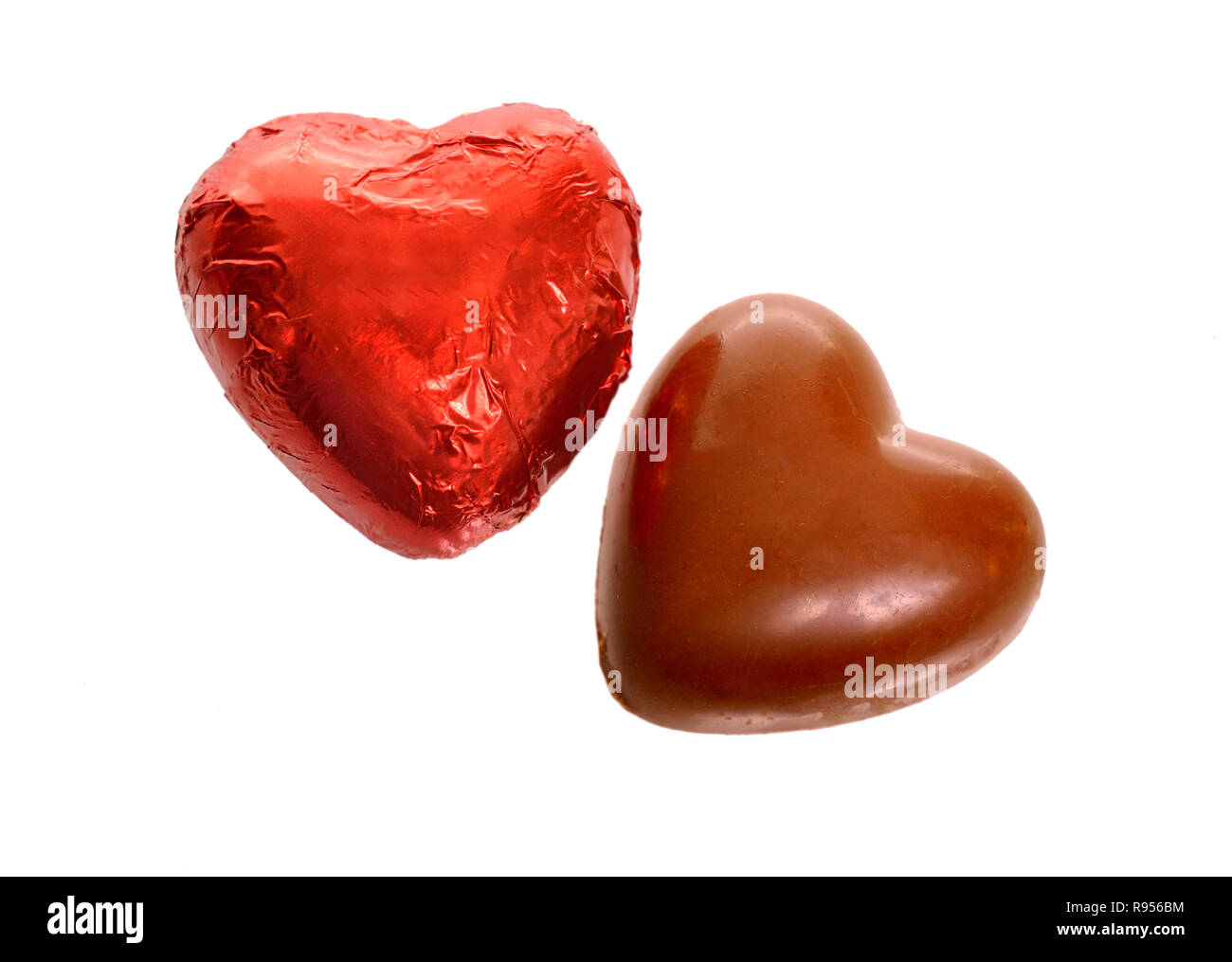 Red Foil wrapped chocolate hearts isolated on white background Stock ...