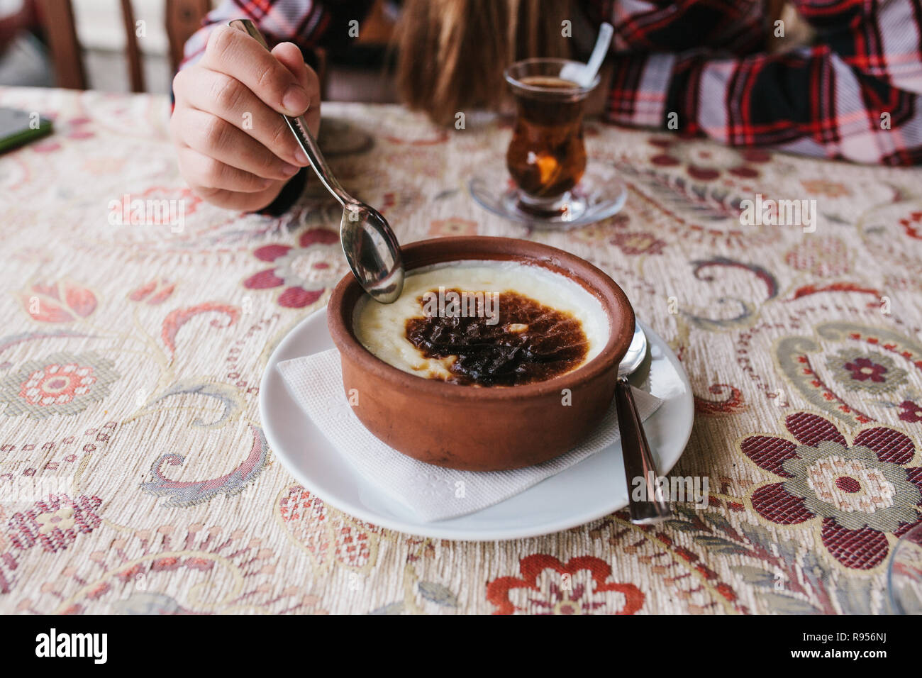Close-up - The girl in the cafe has a baked rice dessert Stock Photo ...