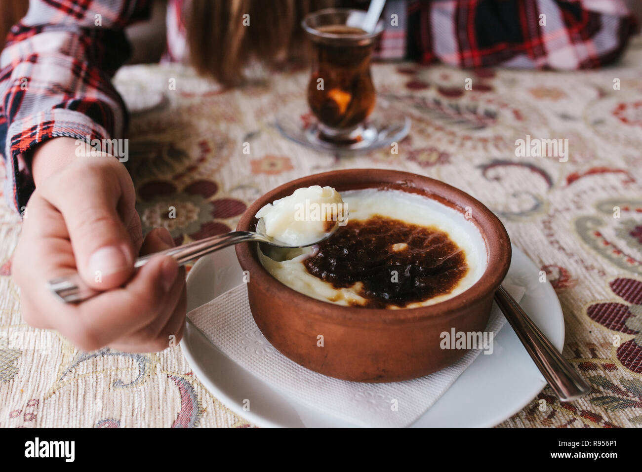 Close-up - The girl in the cafe has a baked rice dessert Stock Photo ...