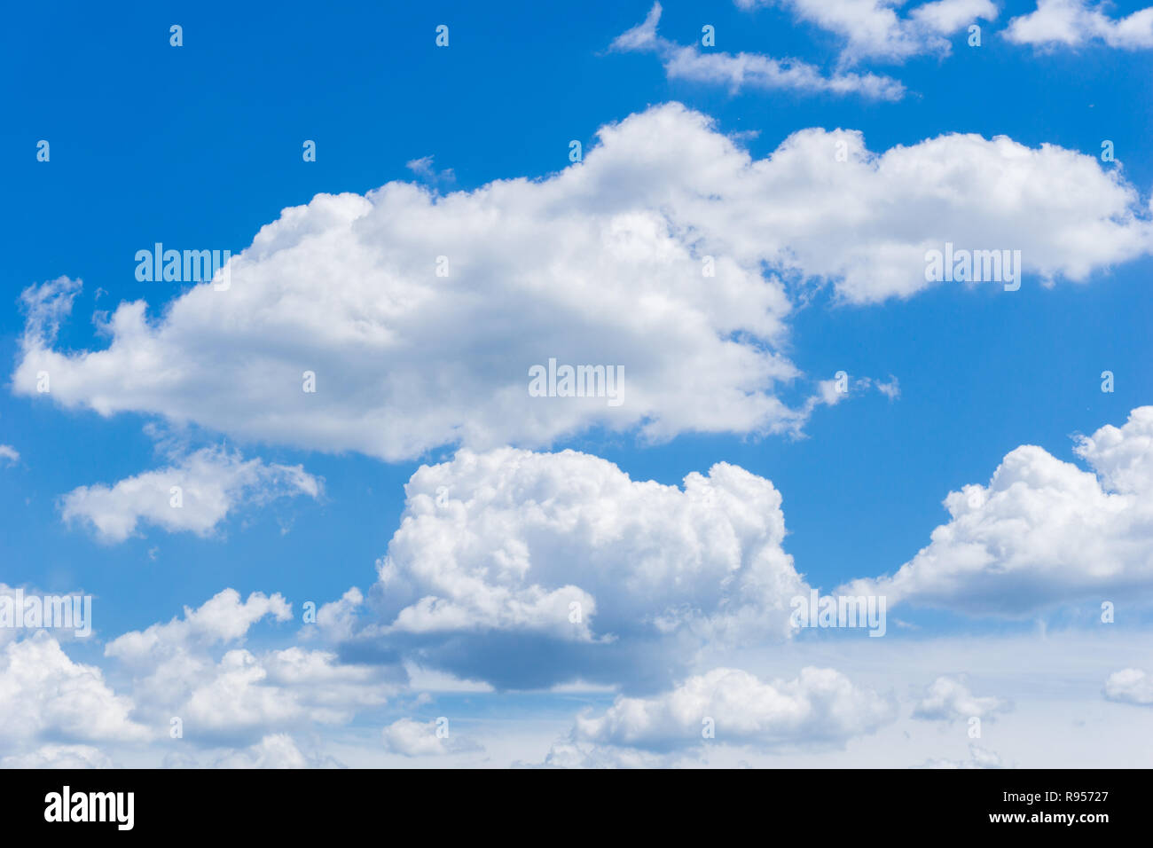 View of white fluffly Clouds on a beautiful Blue Sky Stock Photo - Alamy