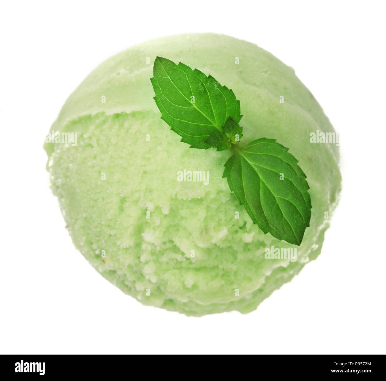 Green tea or pistachio ice cream ball with a mint leaf isolated on ...