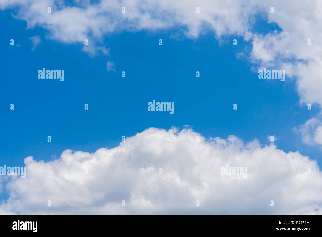 View of white fluffly Clouds on a beautiful Blue Sky Stock Photo - Alamy