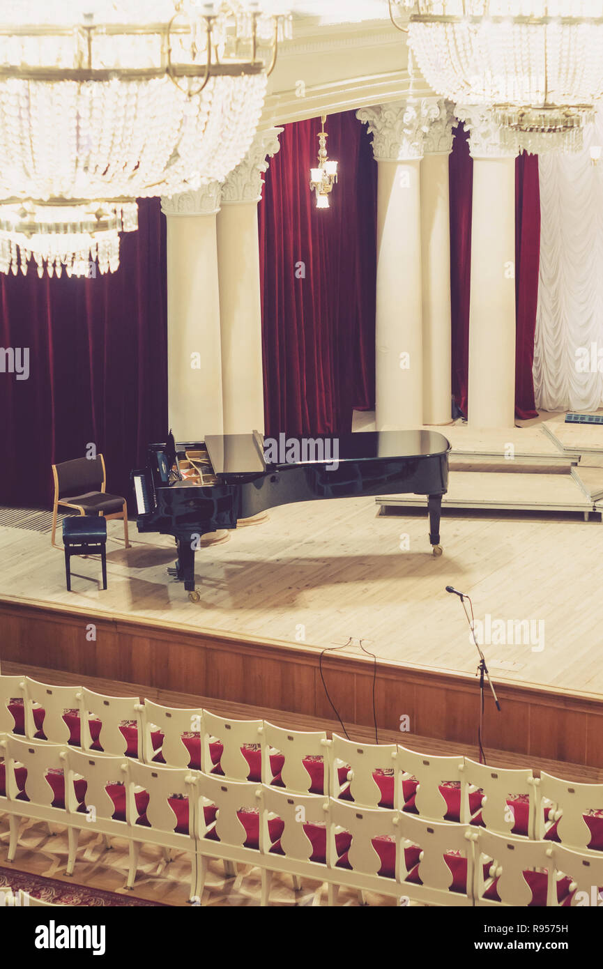 Piano on scene and empty chairs in auditorium of the philharmonic ...