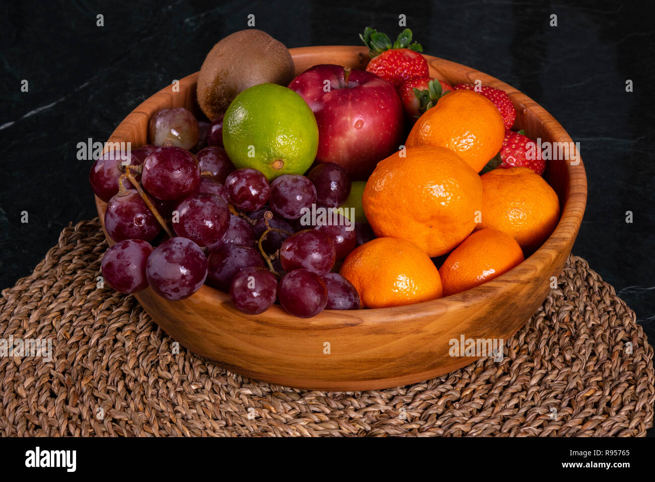 Fruit bamboo bawl filled with variety of fruit Stock Photo - Alamy