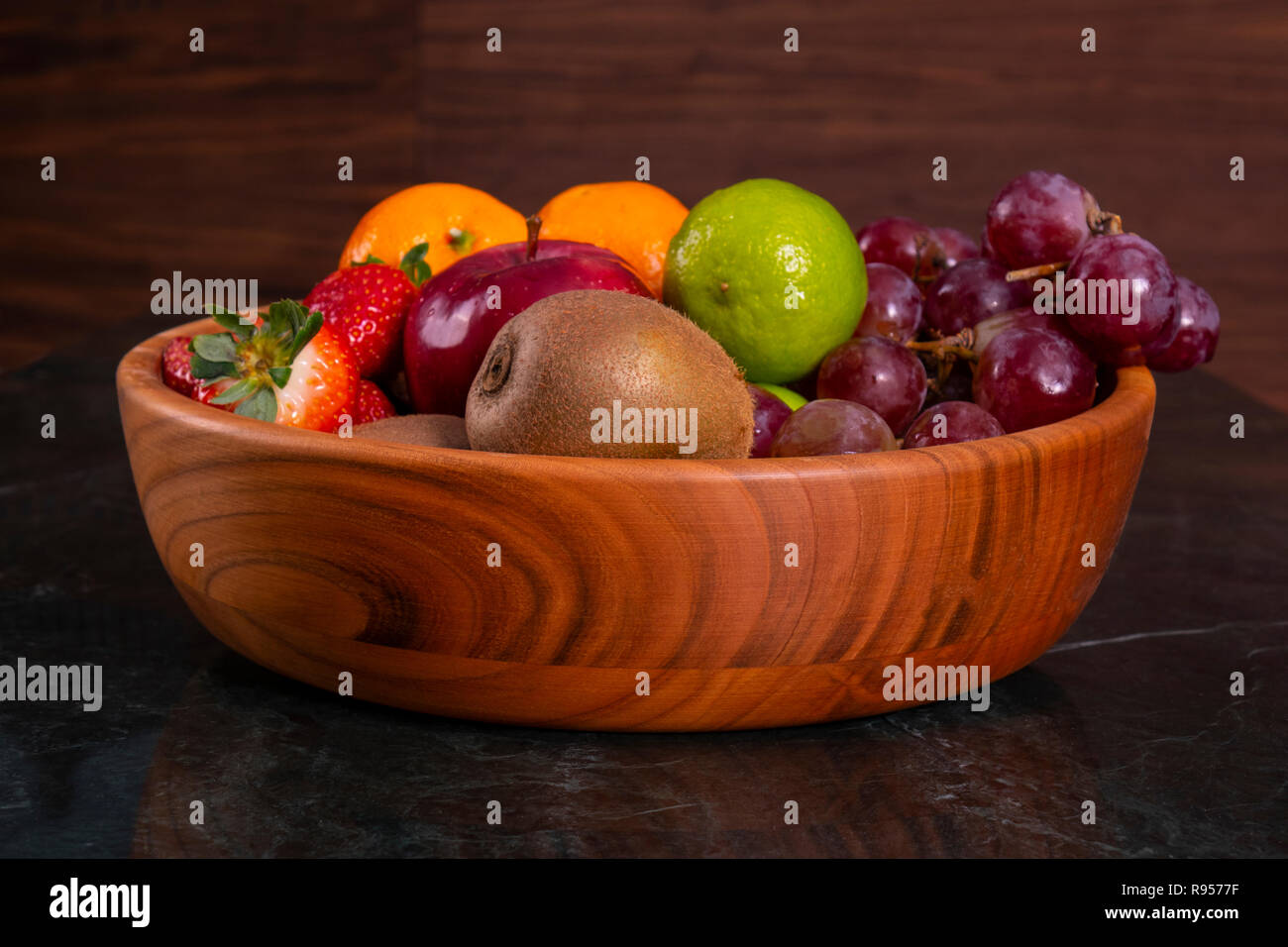Healthy food: mix from fruits in bowl, old marble background, selective ...