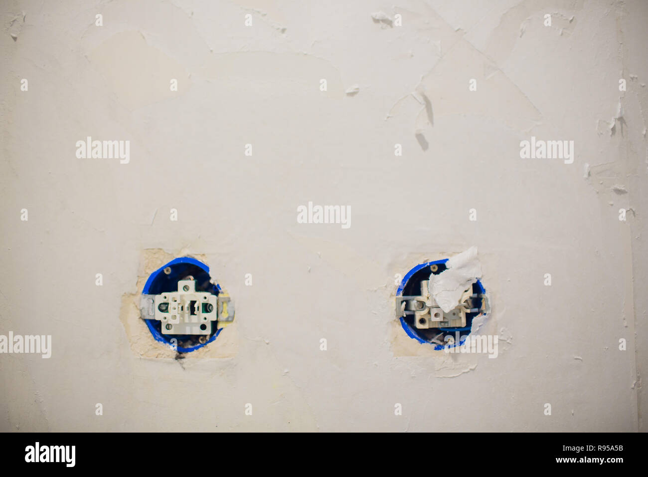 Installing an electrical socket box Stock Photo - Alamy