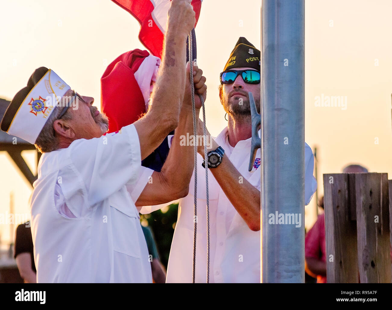 Lowering flag hi-res stock photography and images - Alamy