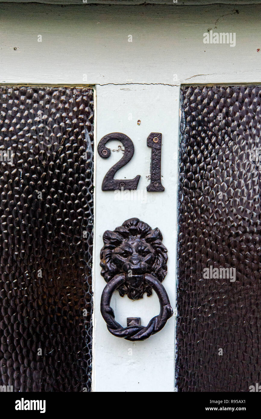 The house number 21 on a white painted door frame in Hertfordshire ...