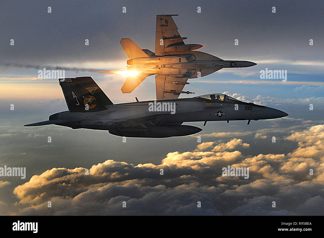 U.S. Navy F/A-18 Super Hornets deploy heat flares during a combat ...