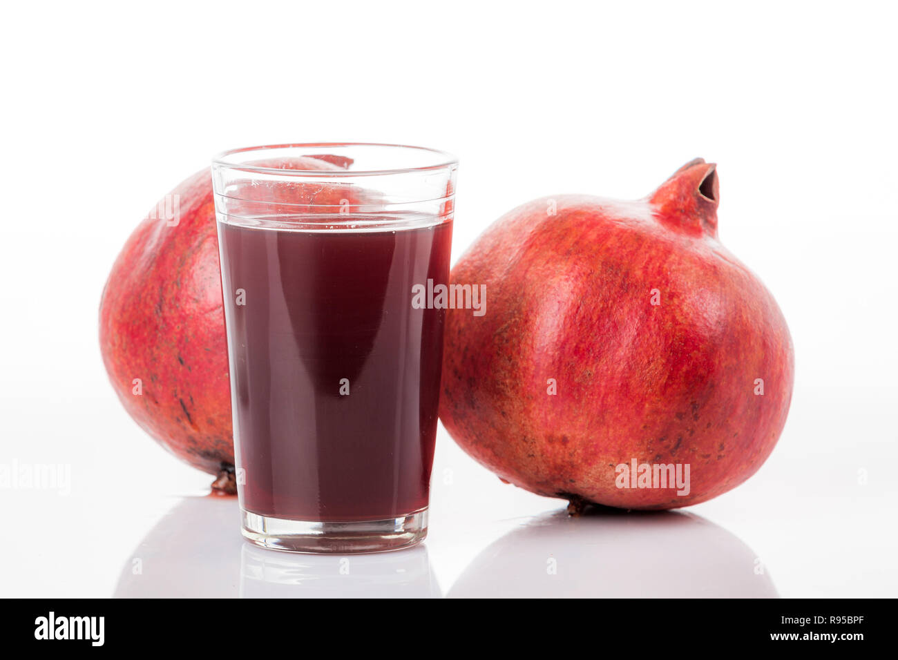 Pomegranate juice with pomegranate isolated on a white background Stock ...