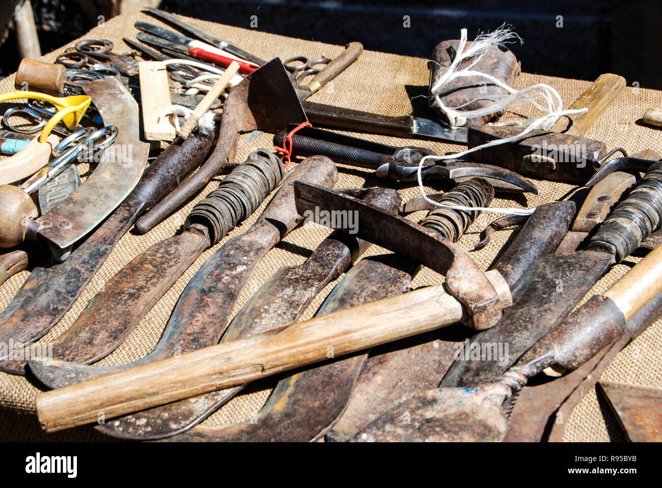 Old working tools with blades to be sharpened Stock Photo - Alamy