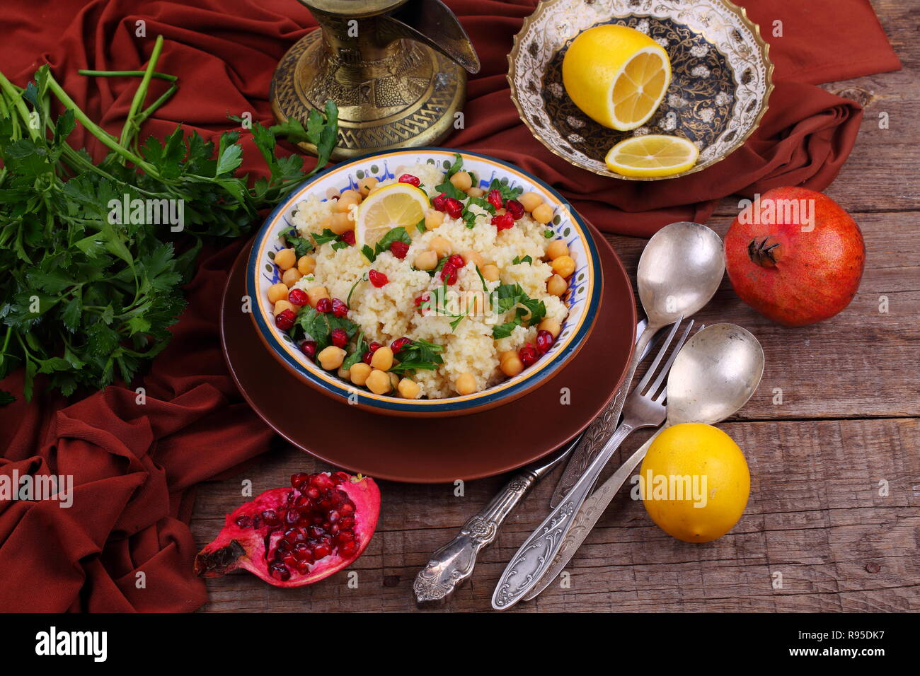 Eastern dish couscous with pomegranate and chickpeas Stock Photo - Alamy