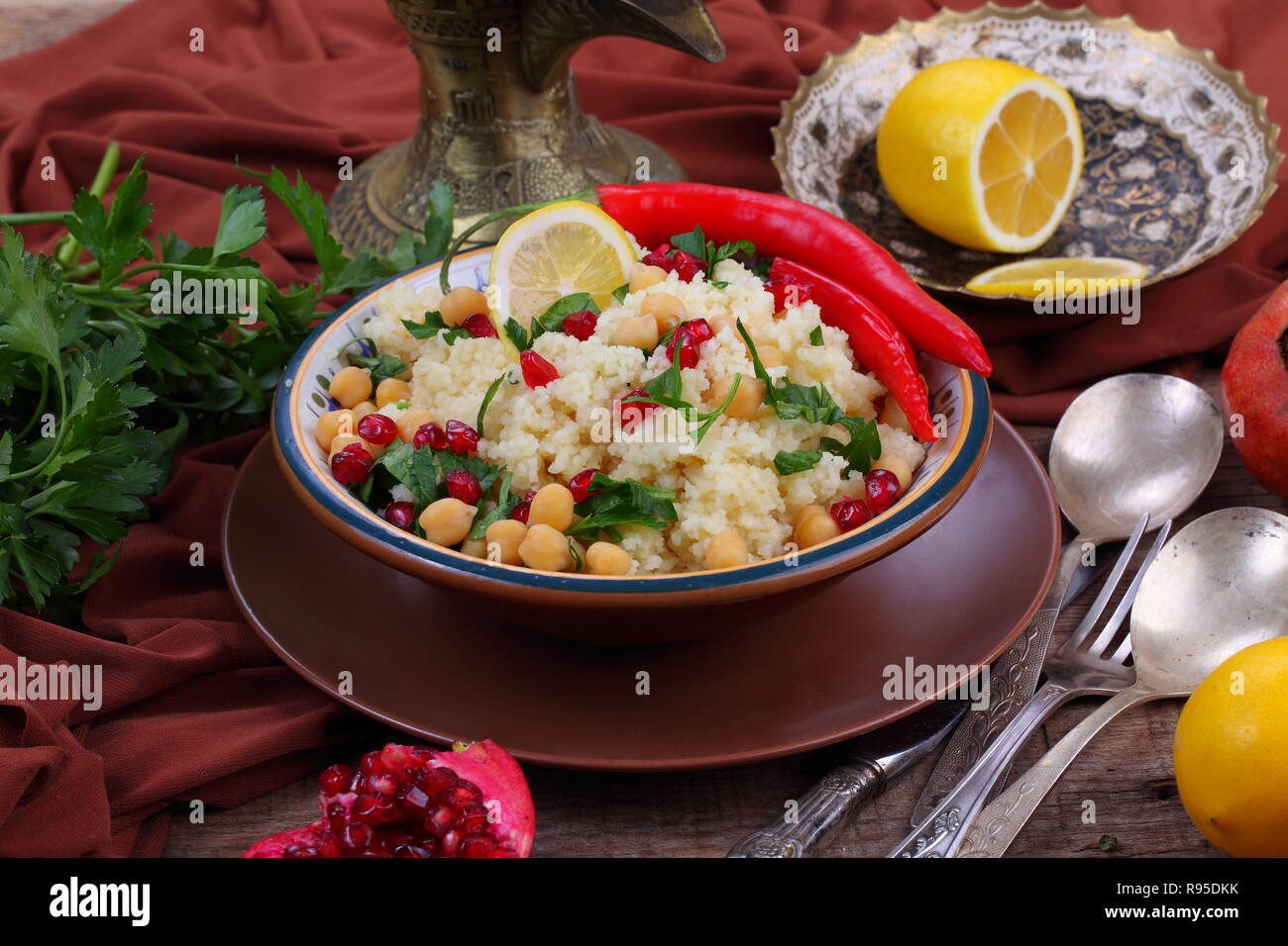 Eastern dish couscous with pomegranate and chickpeas Stock Photo - Alamy