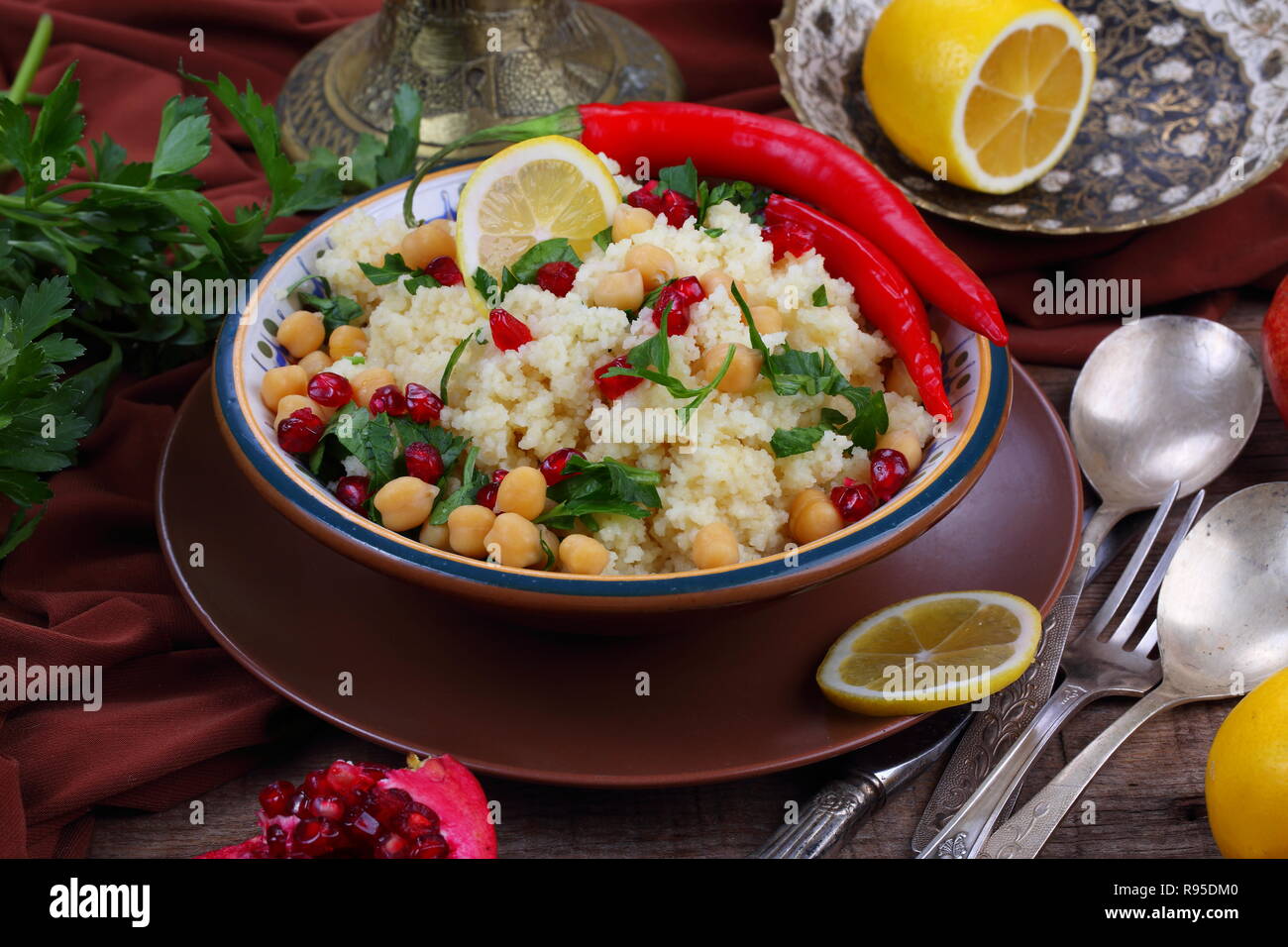 Eastern dish couscous with pomegranate and chickpeas Stock Photo - Alamy