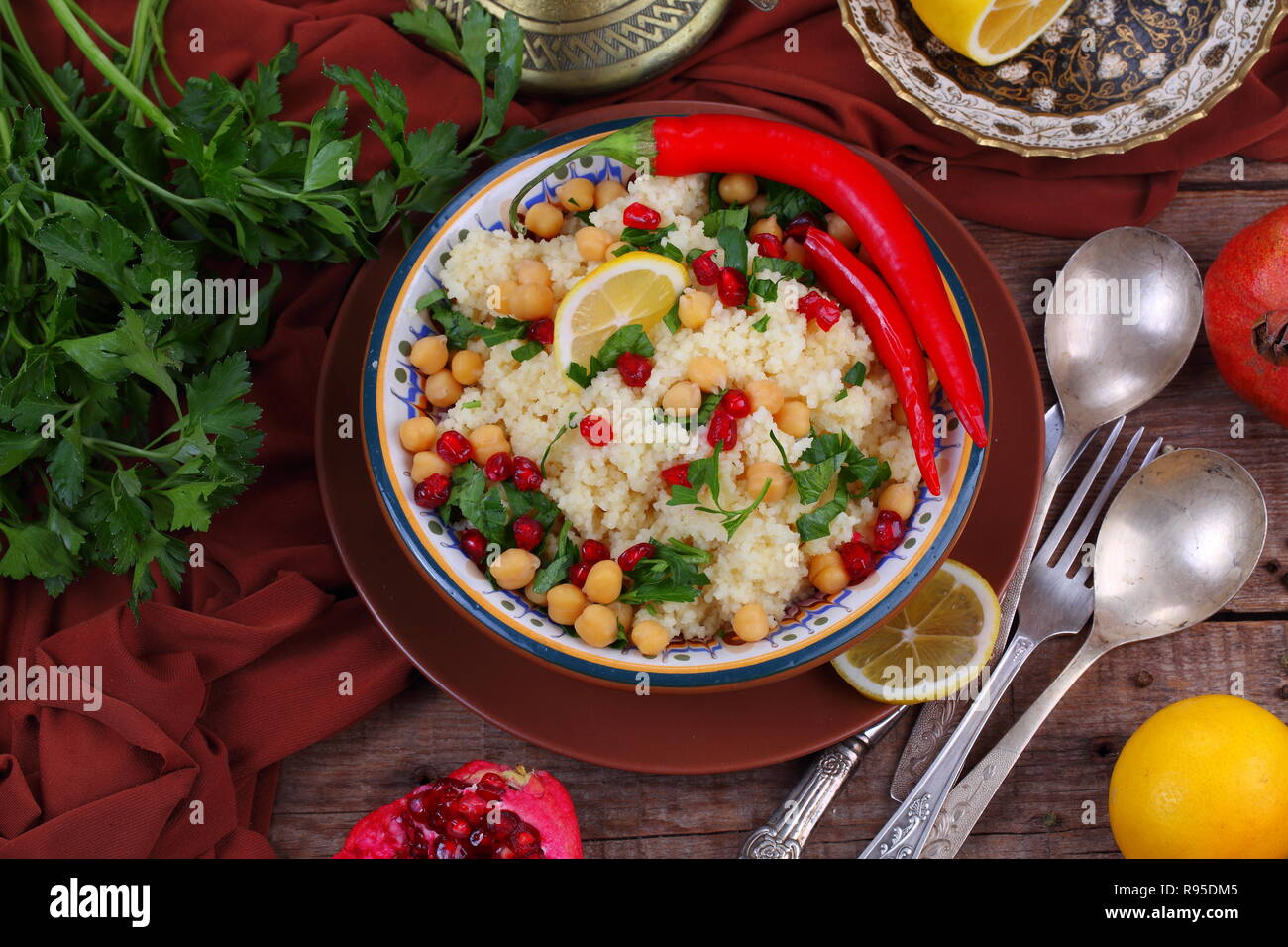 Eastern dish couscous with pomegranate and chickpeas Stock Photo - Alamy