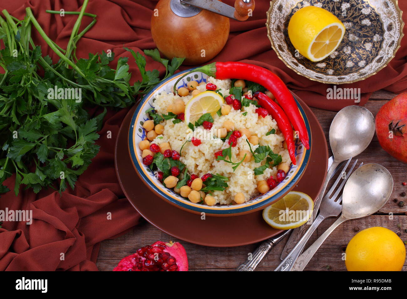 Eastern dish couscous with pomegranate and chickpeas Stock Photo - Alamy