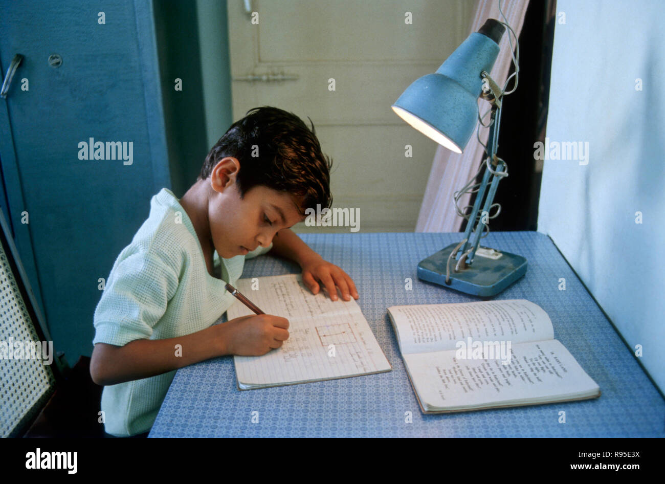 boy doing homework Stock Photo - Alamy