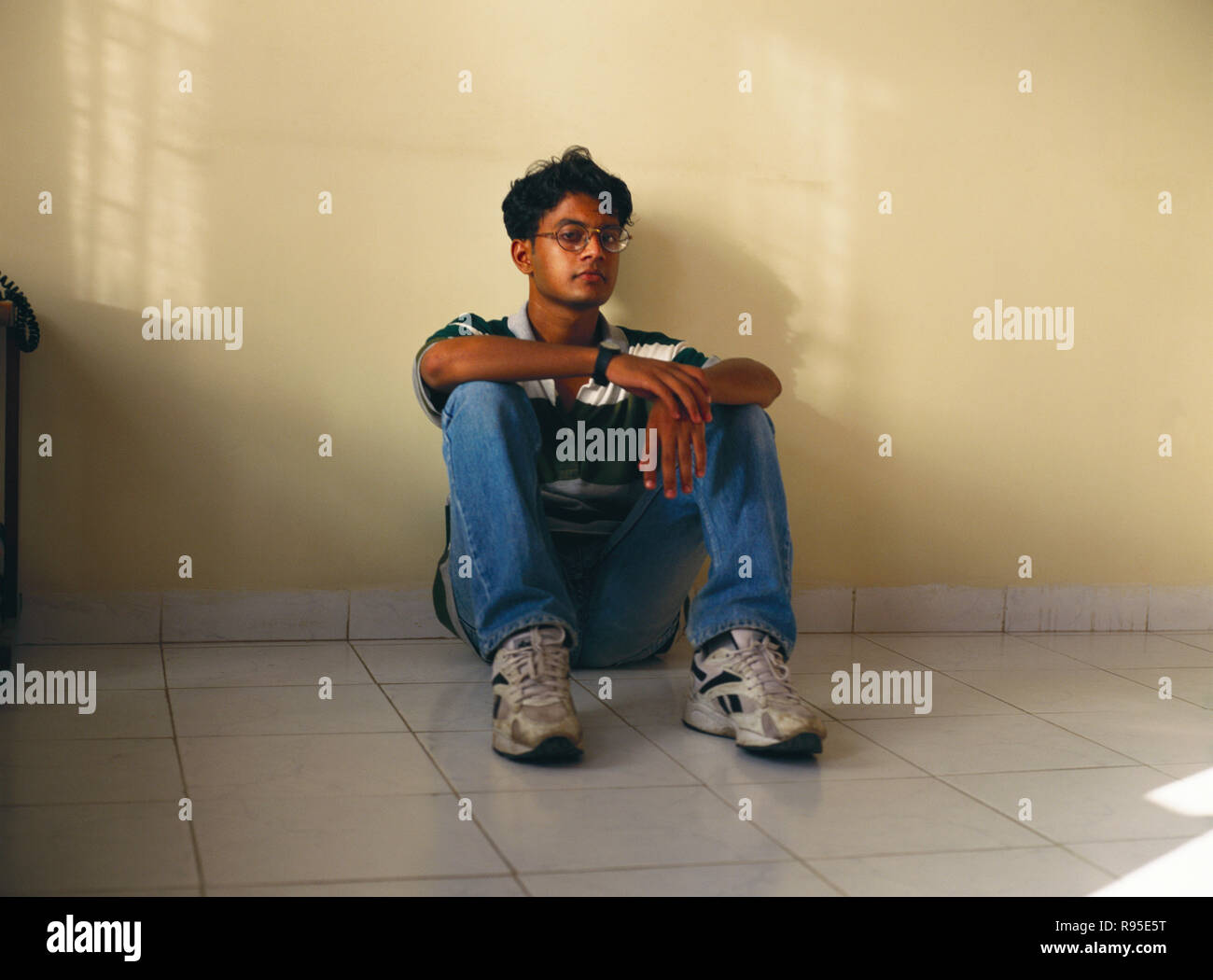 boy seating on floor, india, NO MR Stock Photo - Alamy