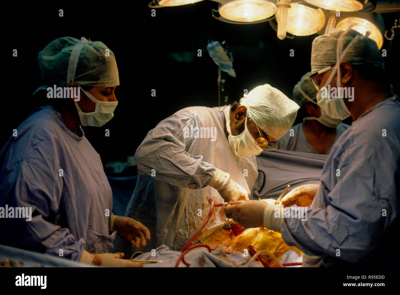 Surgeon conducting operation in operation theater, india Stock Photo ...