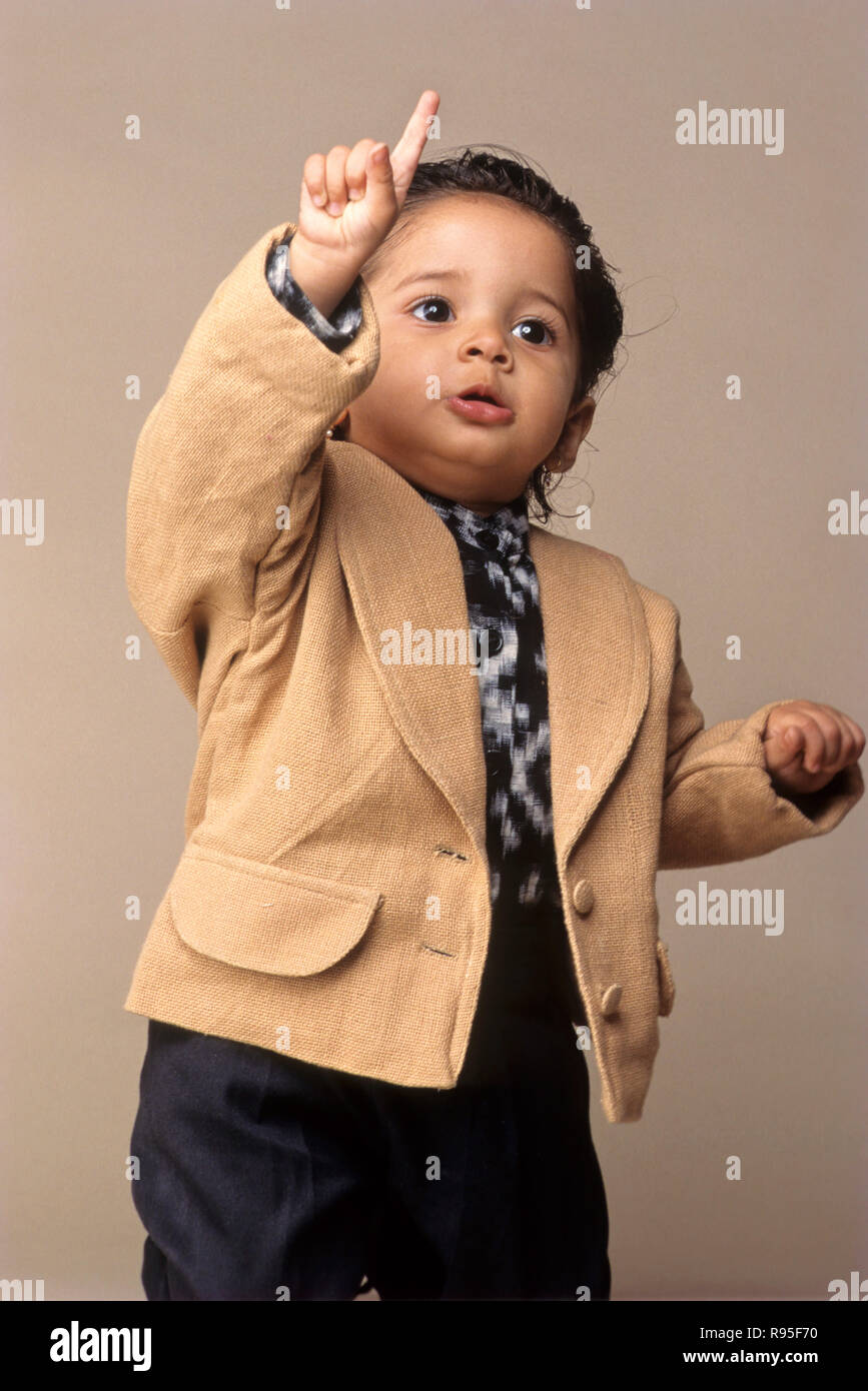 Boy pointing finger Stock Photo - Alamy