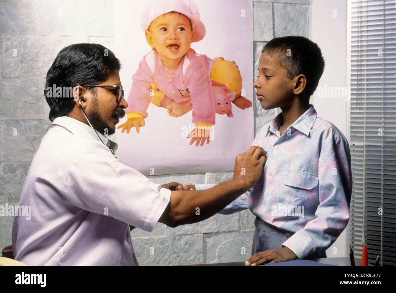 Doctor checking seeing examining child patient - MR#334&335 Stock Photo ...