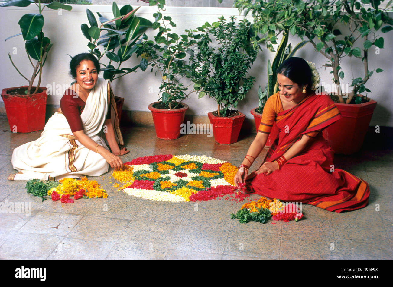 Pookalam, Onam Festival, women making flower rangoli, Kerala, India ...