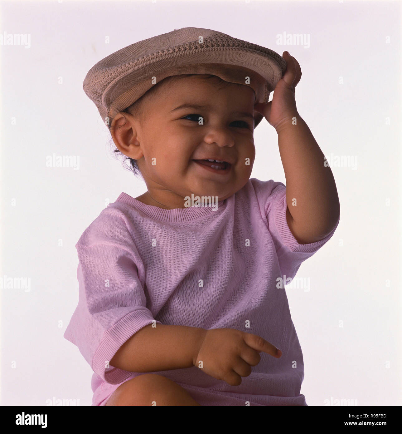Baby boy, wearing cap, portrait, white background, MR Stock Photo - Alamy