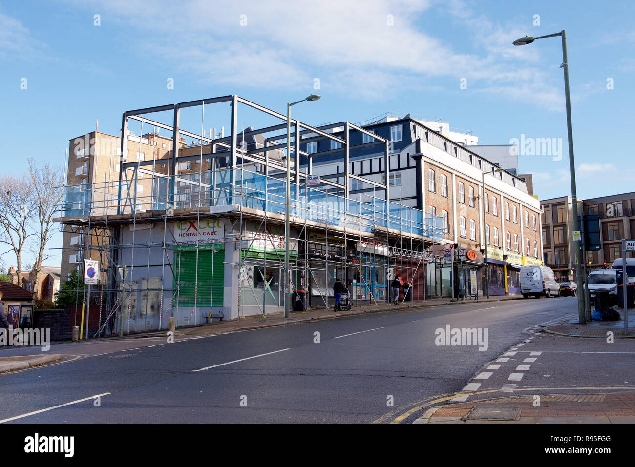 Construction work extending shops in a city street Stock Photo - Alamy