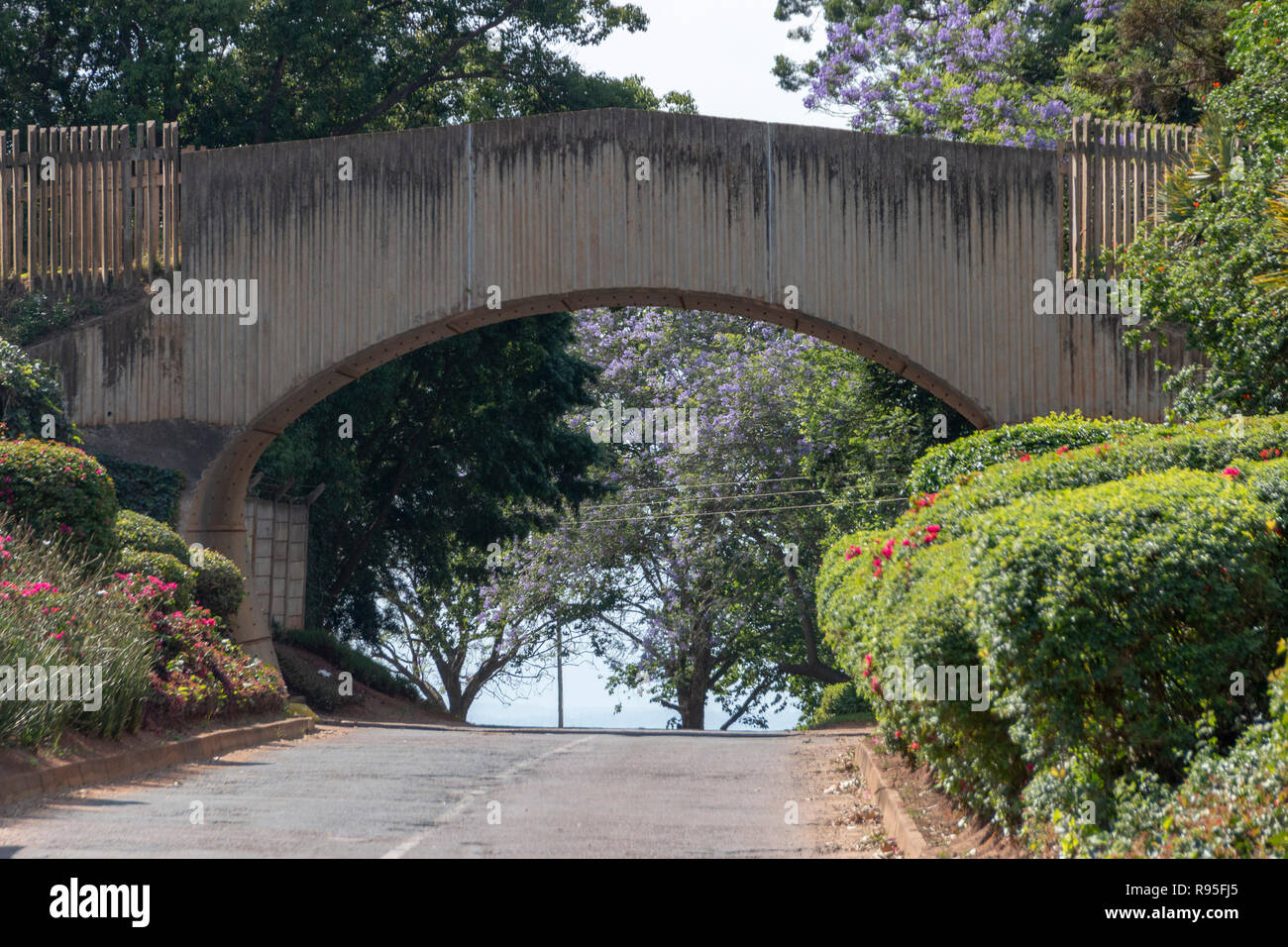 A close up front on view of a concrete overghead open bridge going over ...