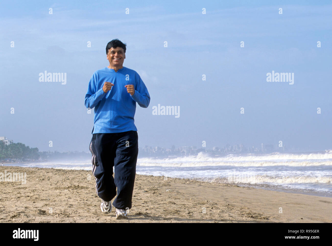 Senior man jogging on beach - MR#448 Stock Photo - Alamy