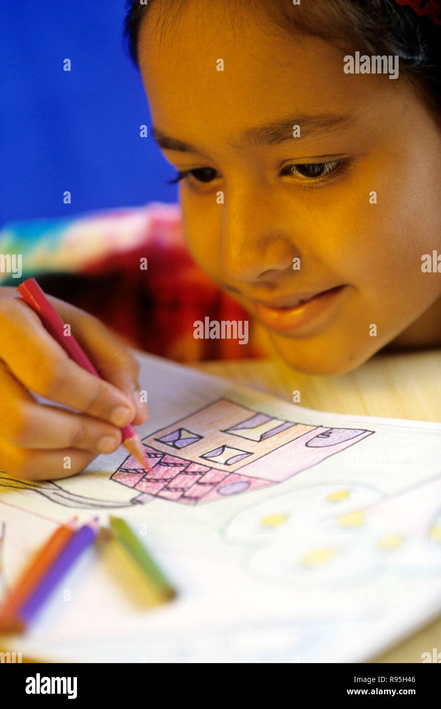 Girl drawing with color pencil Stock Photo - Alamy