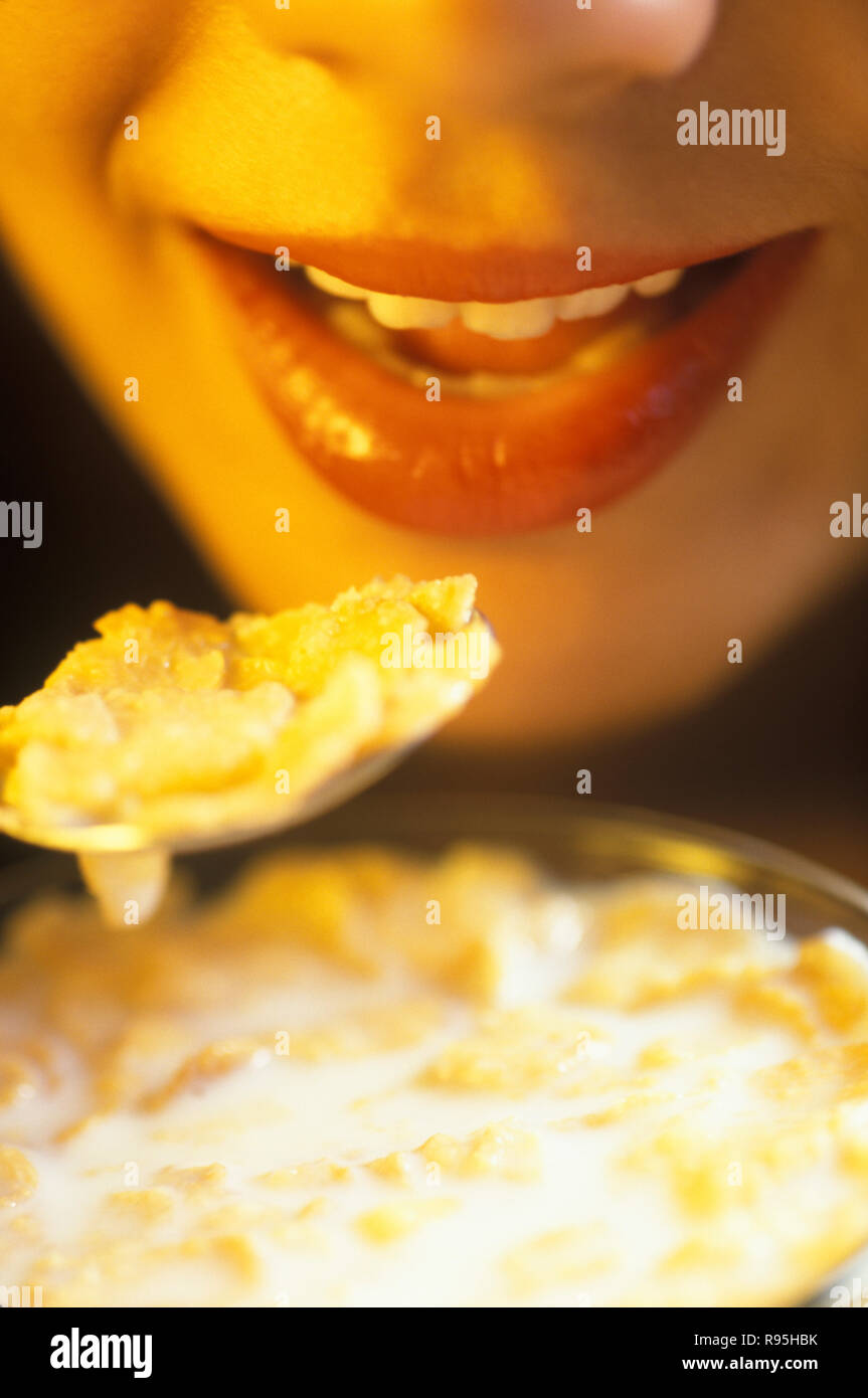 Woman eating Cornflakes Breakfast Stock Photo - Alamy