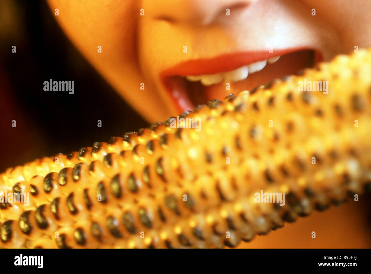 Indian girl eating corn hi-res stock photography and images - Alamy