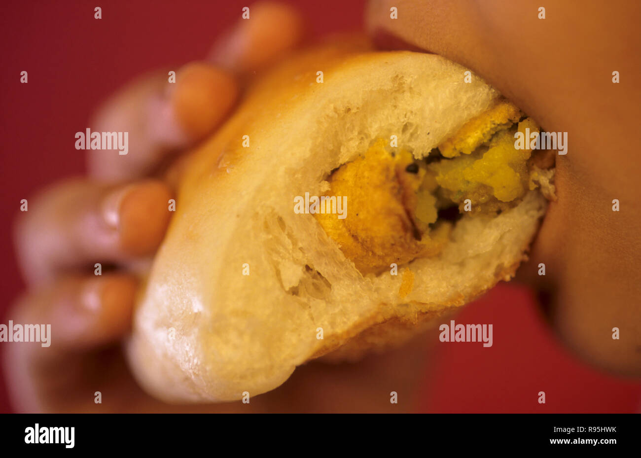 Indian Food hot dog Vada Pav eating Stock Photo - Alamy