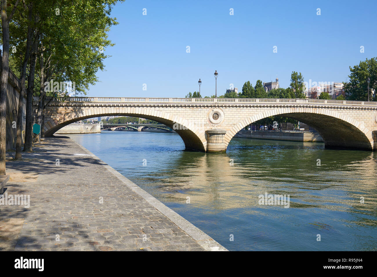 Paris, empty Seine river docks and bridge in a sunny summer day in ...