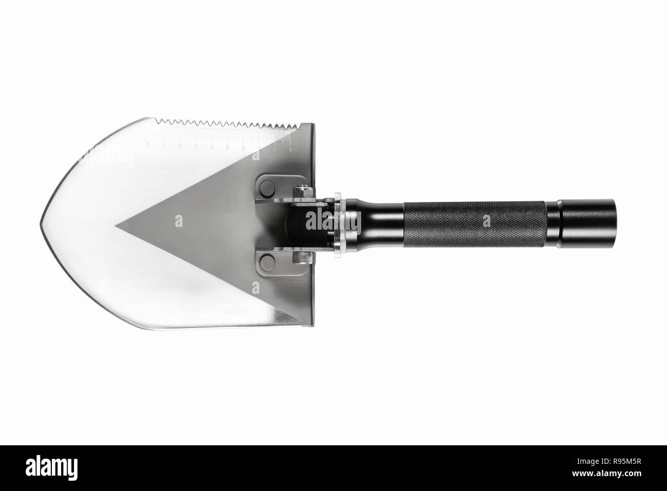 Sharp metal shovel with a saw on white background. Isolated Stock Photo ...