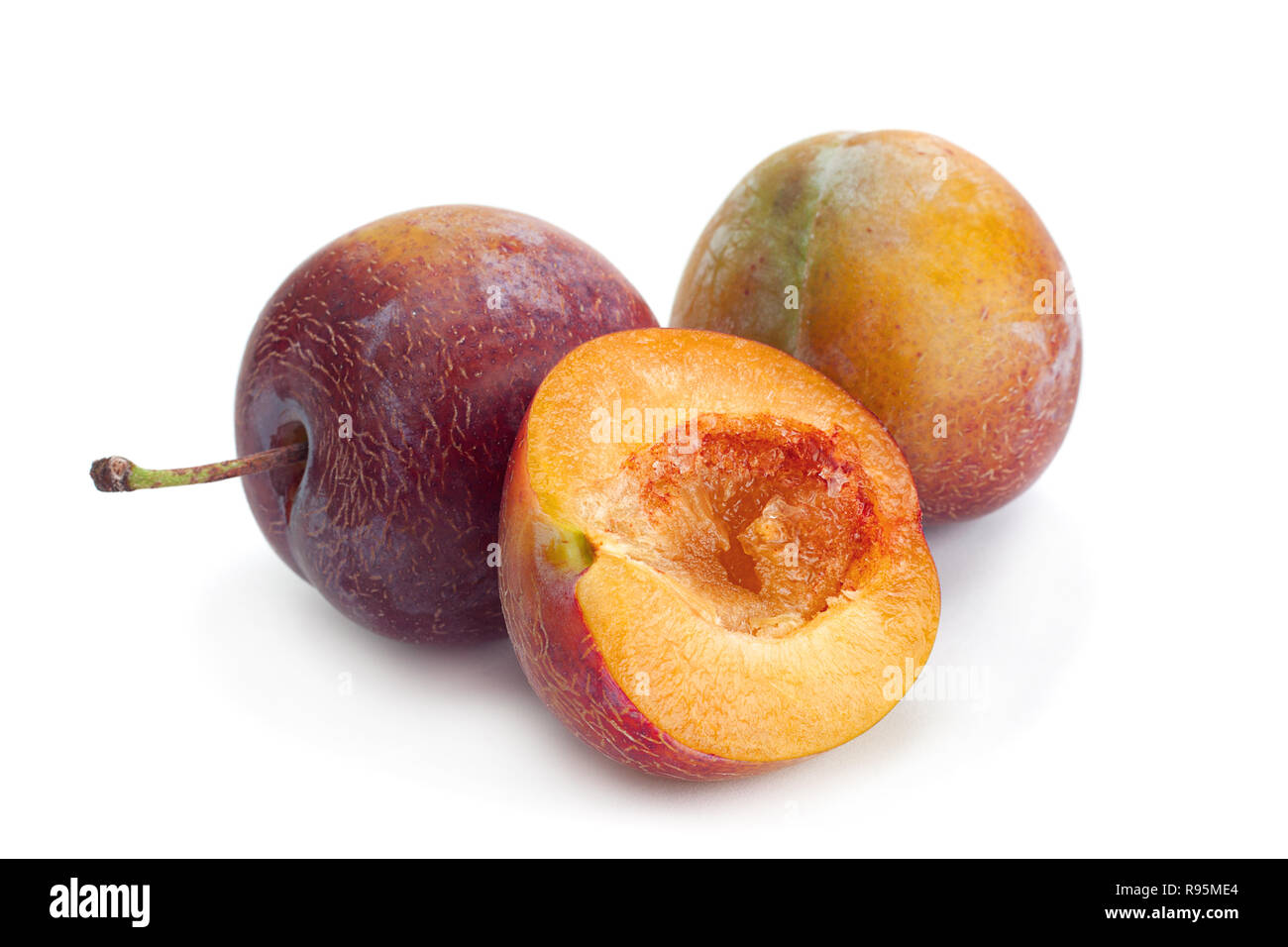 Brown plum slice closeup isolated on white background Stock Photo - Alamy
