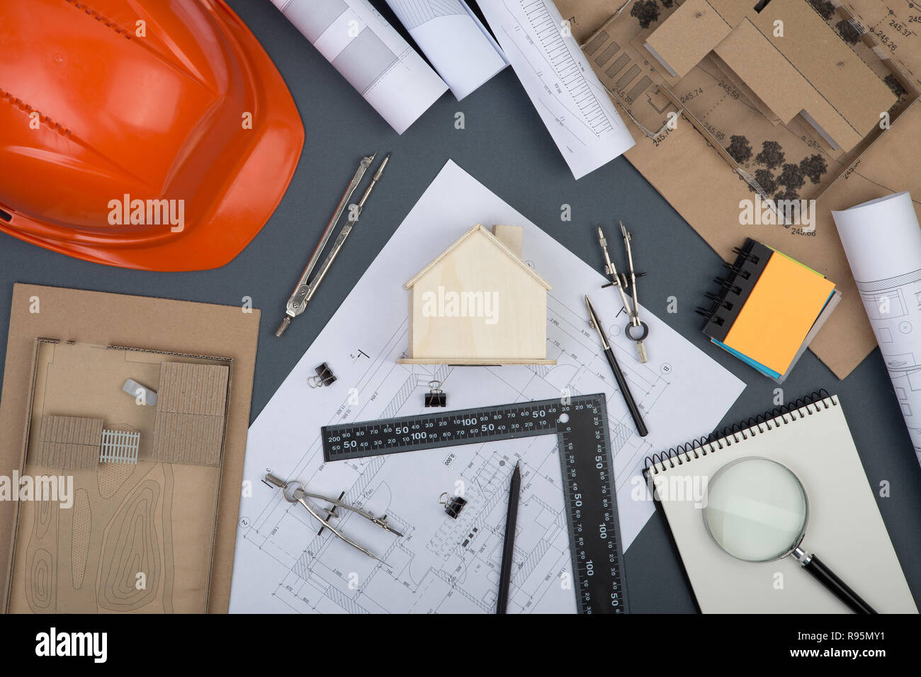 Workplace of architect - note pad, construction drawings and ...