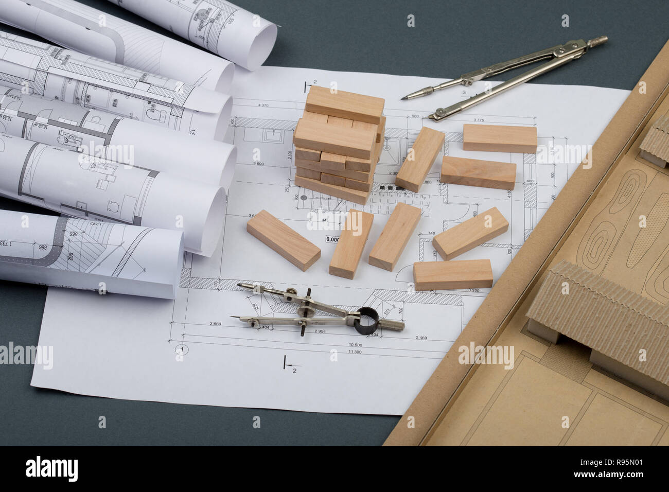 Workplace of architect - model house from wooden blocks, construction ...