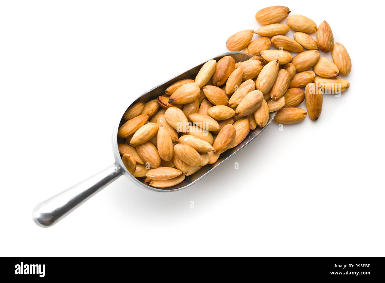 Salty roasted almonds in scoop isolated on white background Stock Photo ...