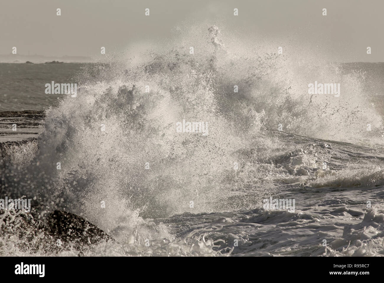 Closeup of a big splash from a breaking stormy sea wave Stock Photo - Alamy