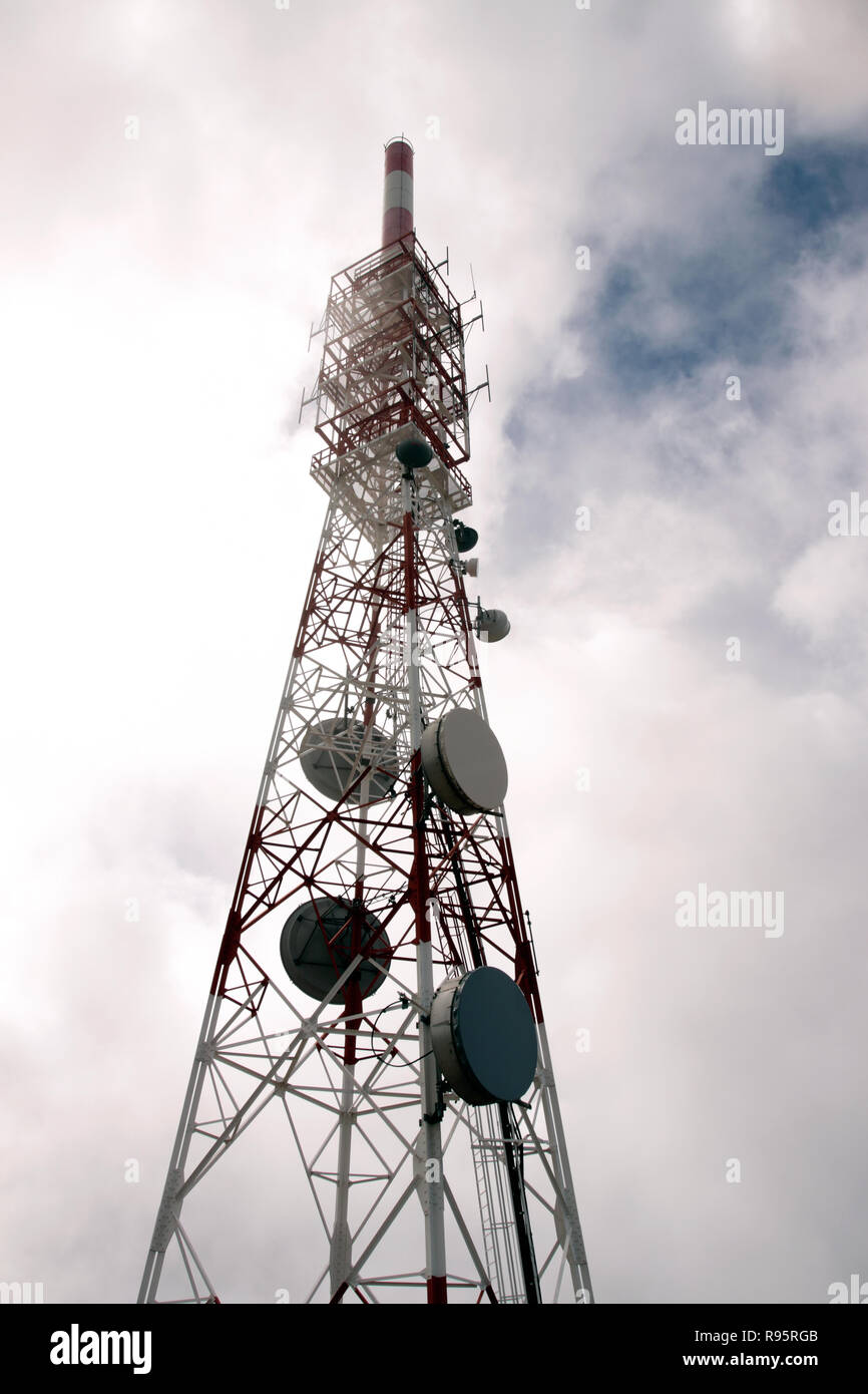Tower of communications with antennas in the middle of clouds Stock ...