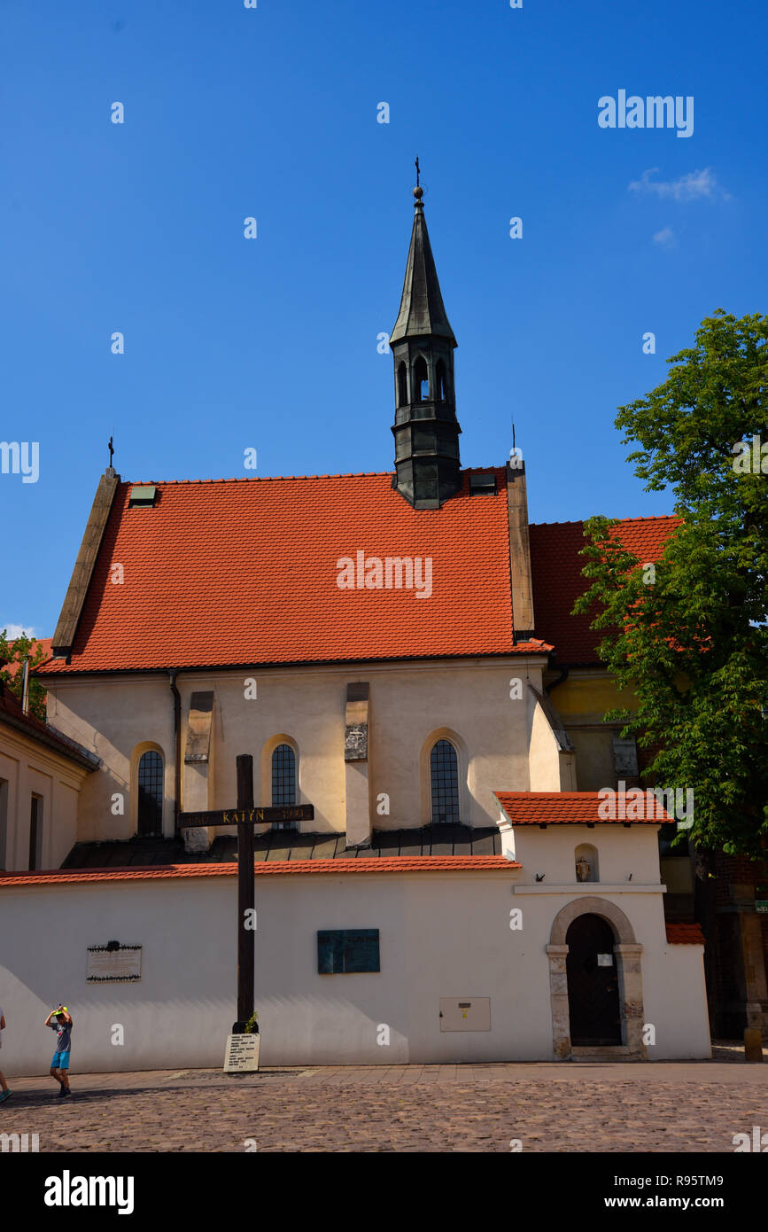 The Church of St Giles. The Cross commemorates the Massacres of Katyn ...