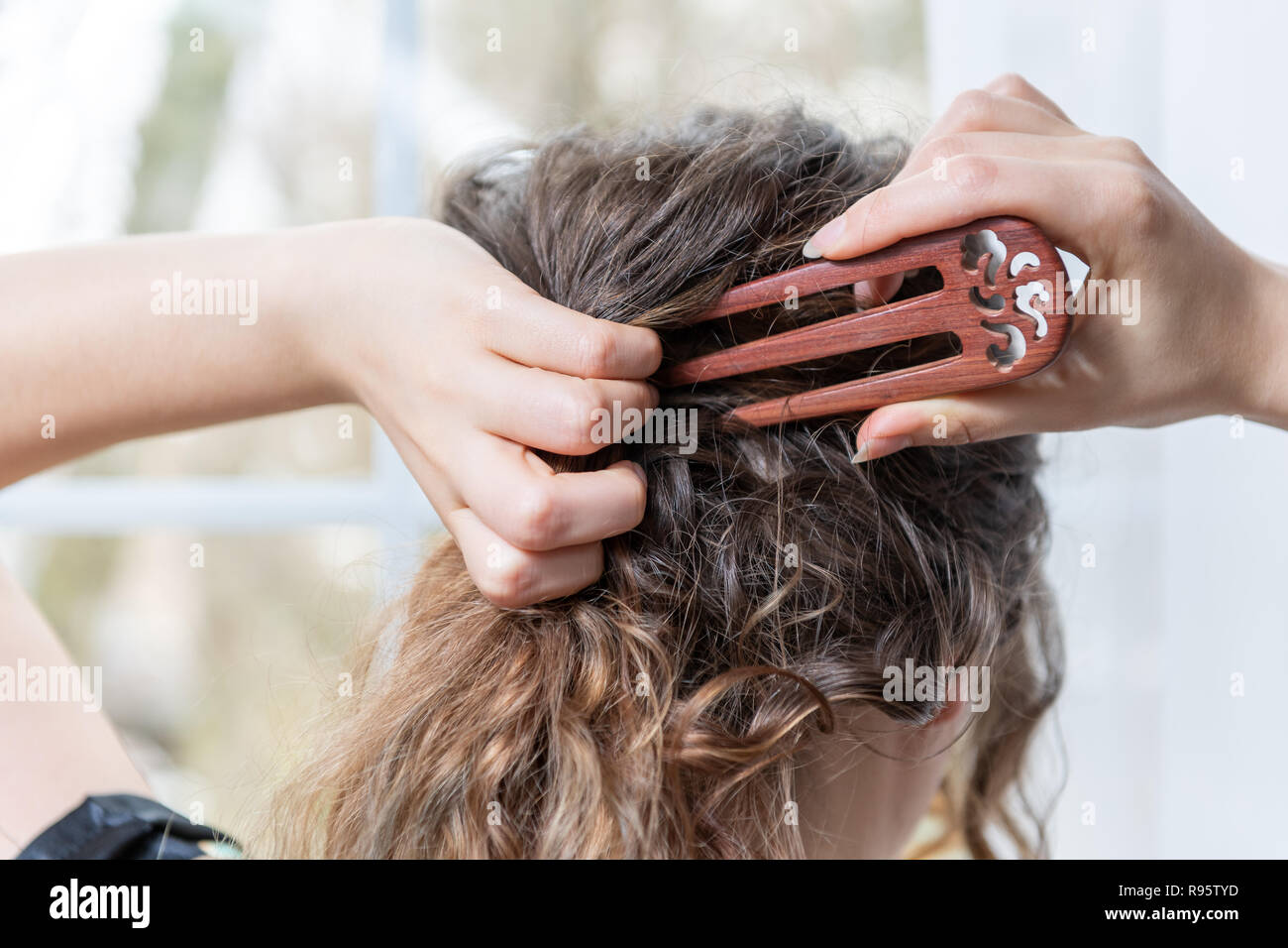 Closeup behind portrait of female back, young brunette woman making ...