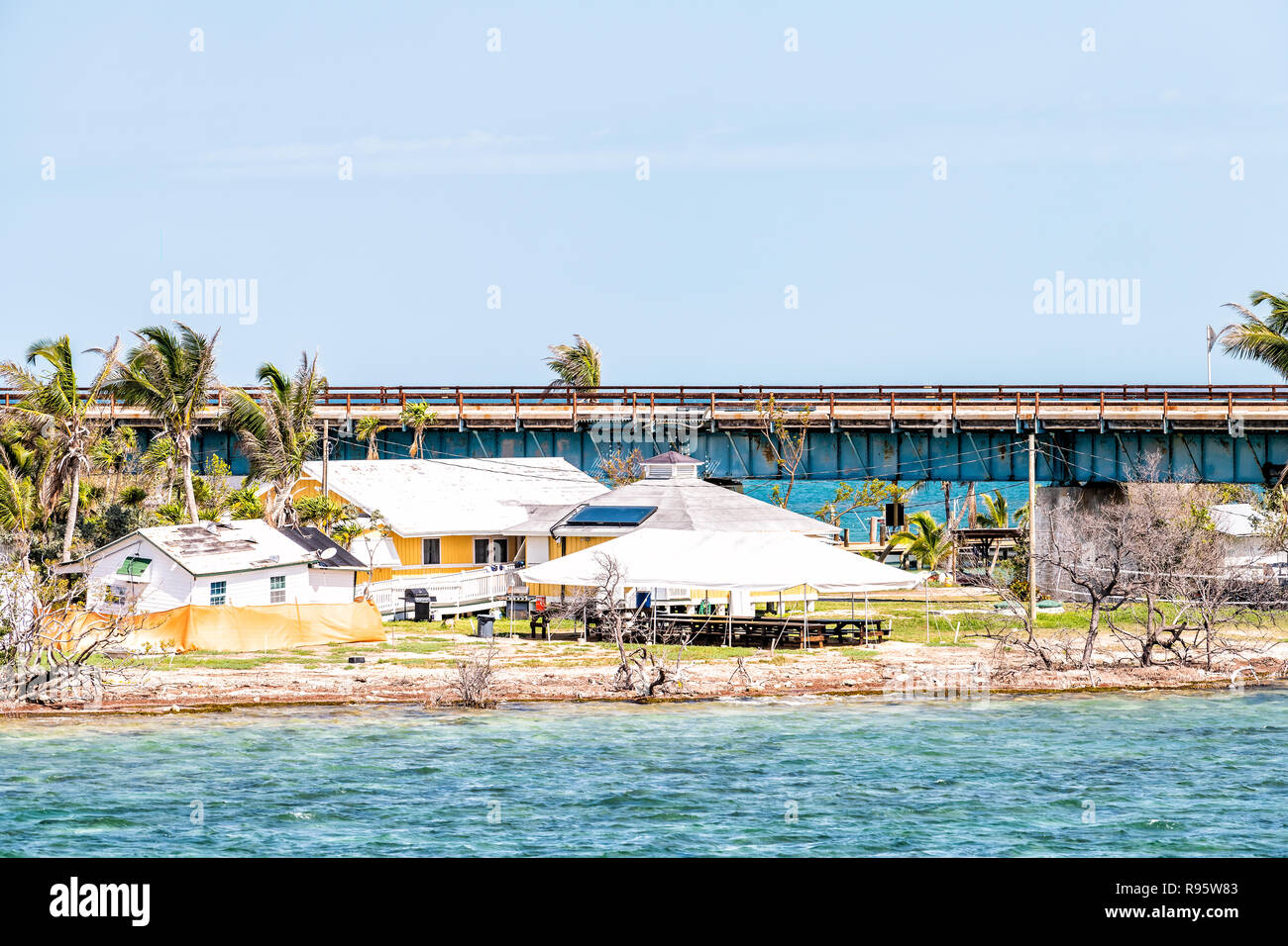 Many damaged, destroyed houses on beach by shore, coast in Florida keys ...