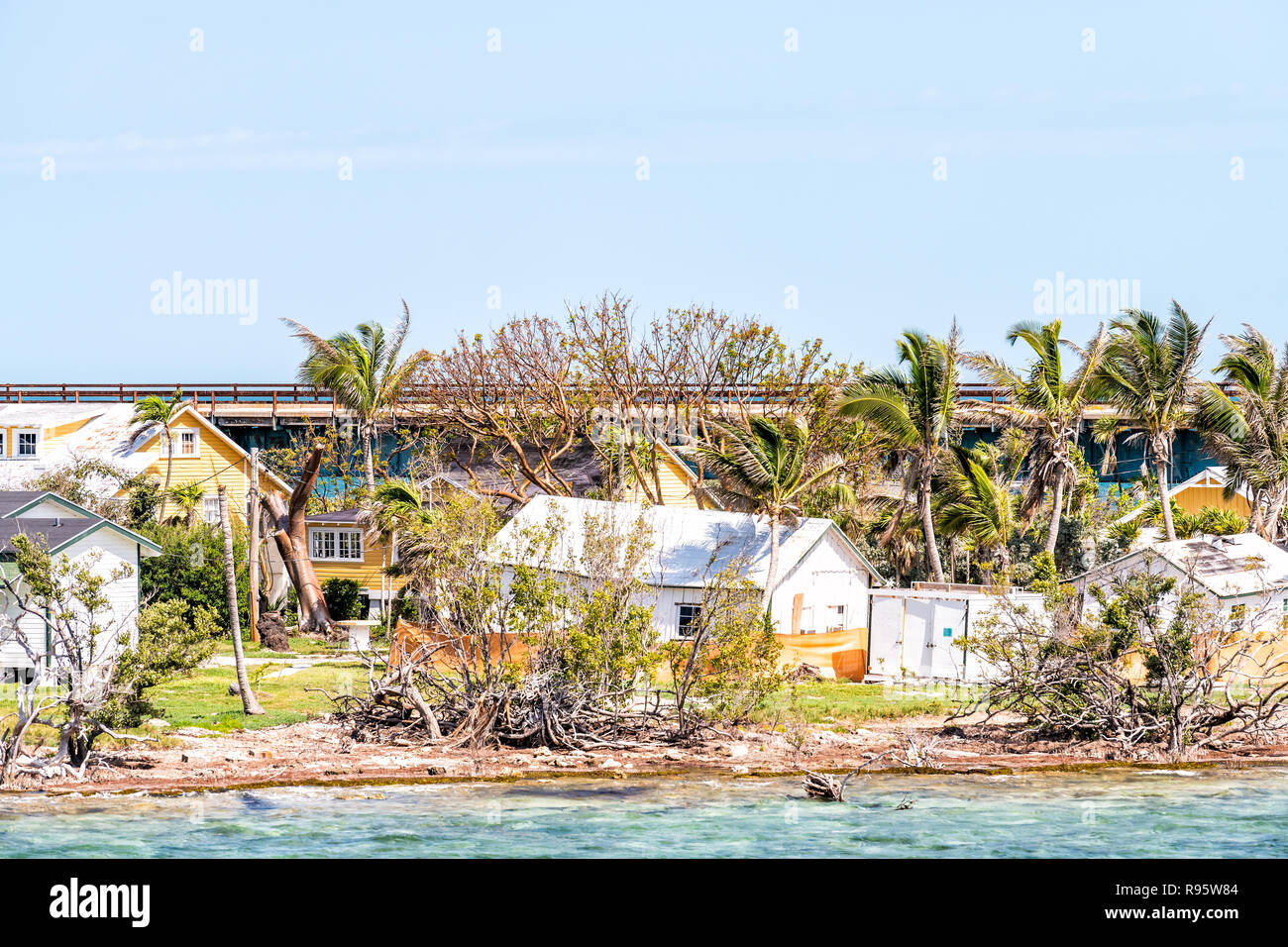 Many damaged, destroyed houses on beach by shore, coast in Florida keys ...